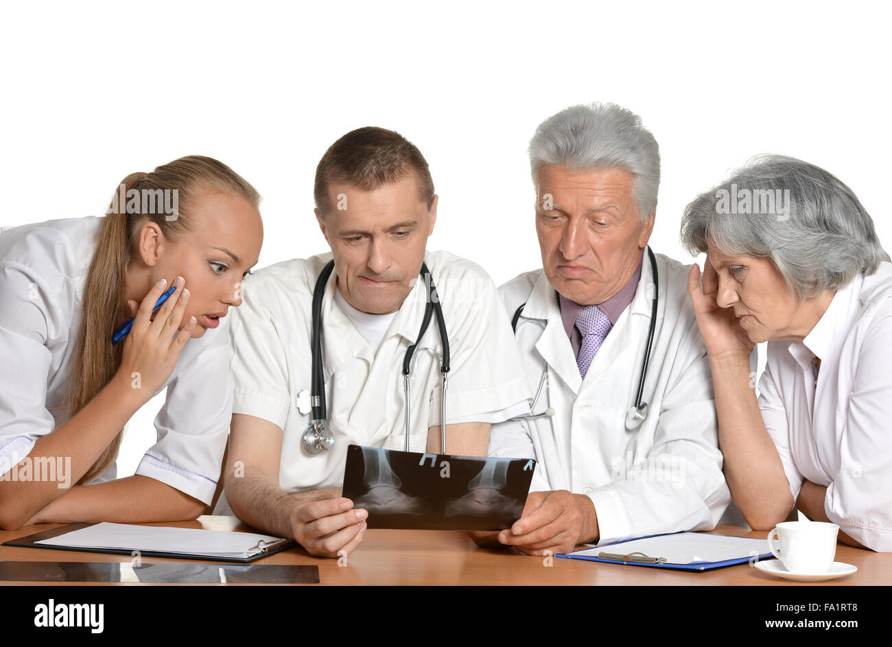 Doctors discussing at table Stock Photo - Alamy