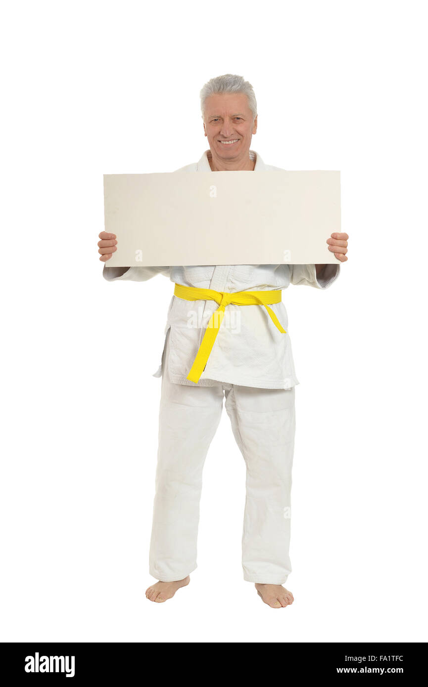 Karate Senior man with poster Stock Photo - Alamy