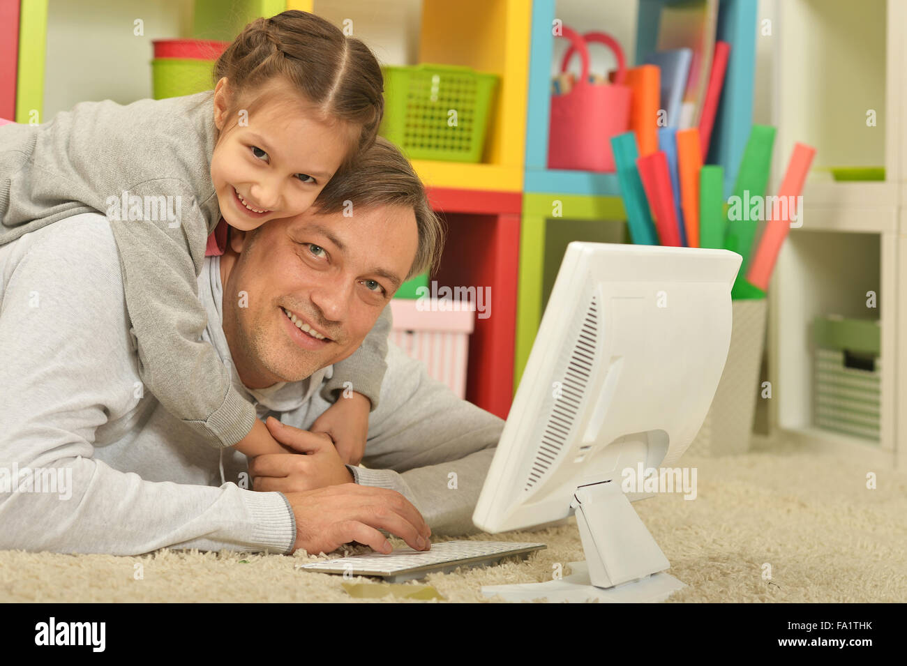 father and little daughter with computer Stock Photo - Alamy