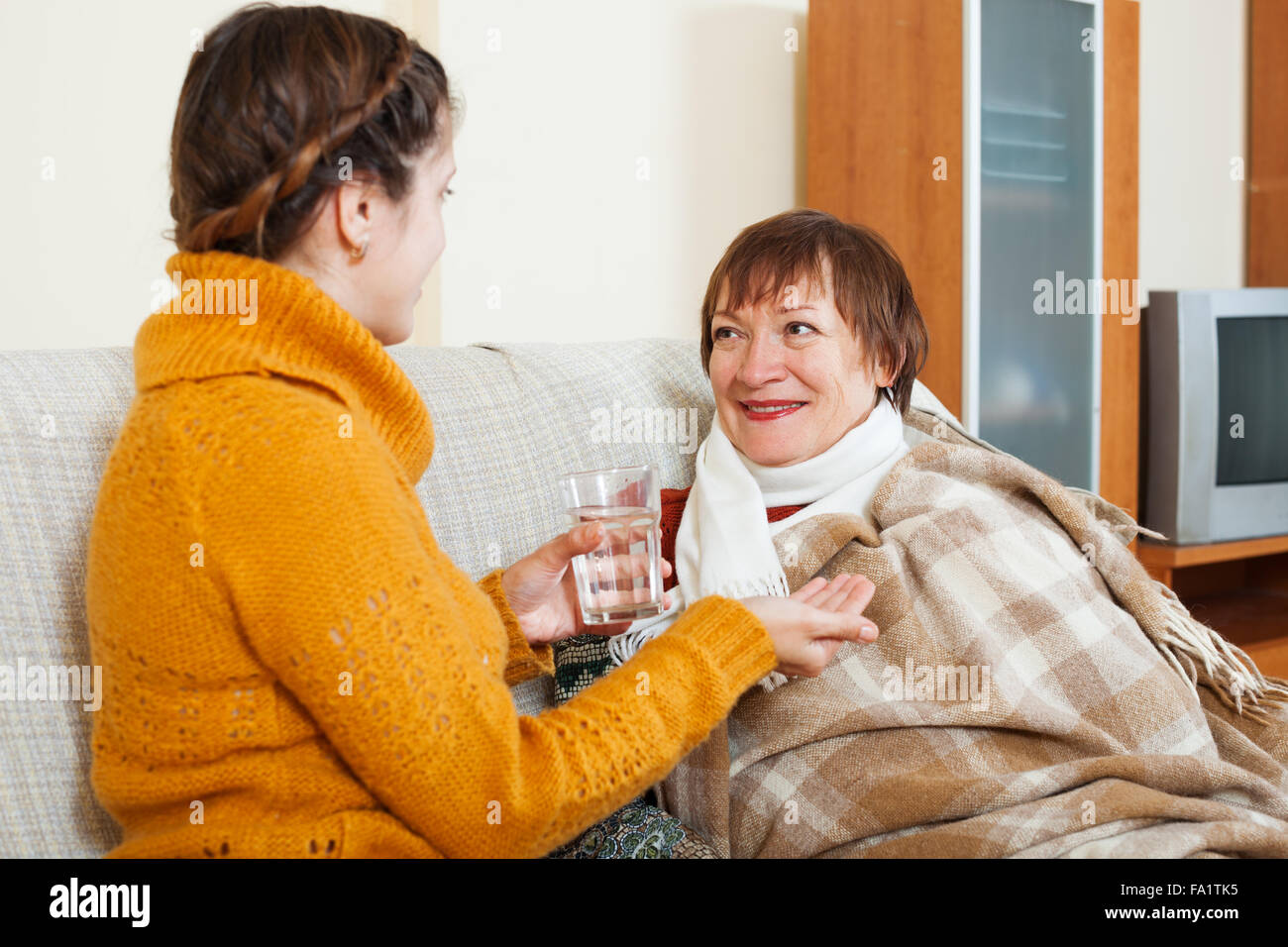 Daughter caring sick mother cold hi-res stock photography and images ...