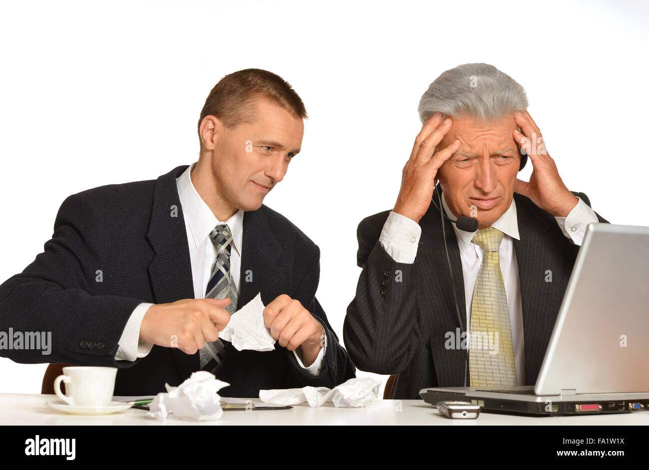 Portrait of businessmen at table Stock Photo - Alamy