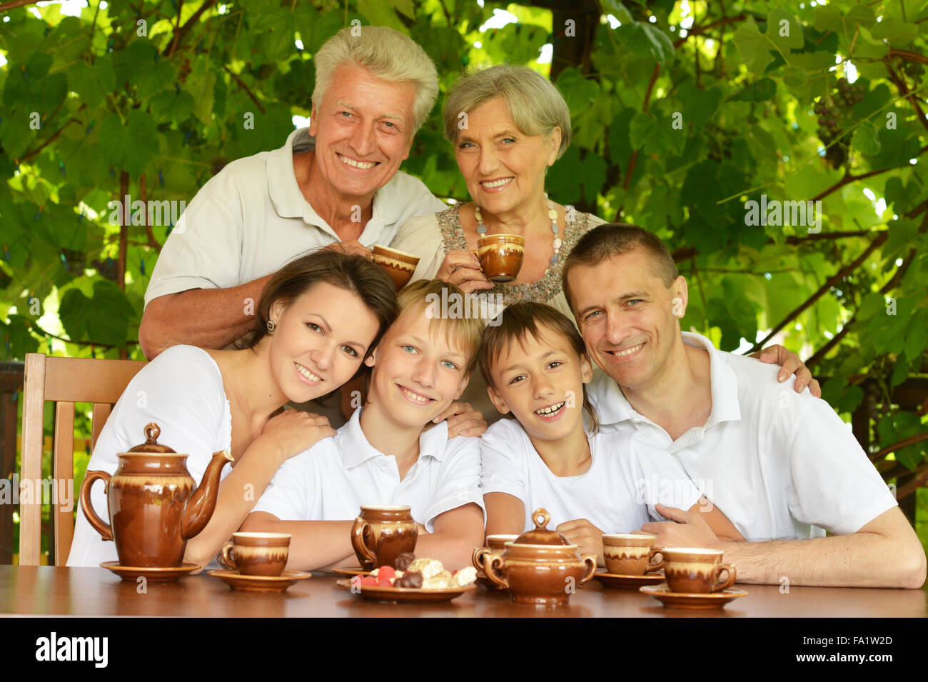 family drinking tea Stock Photo - Alamy