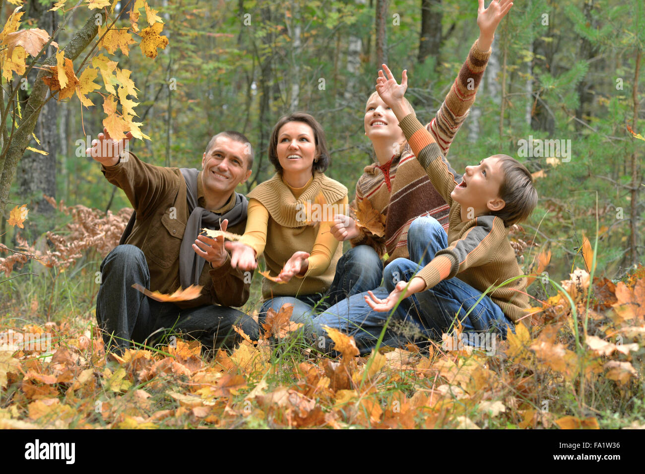 Portrait of family relaxing Stock Photo - Alamy
