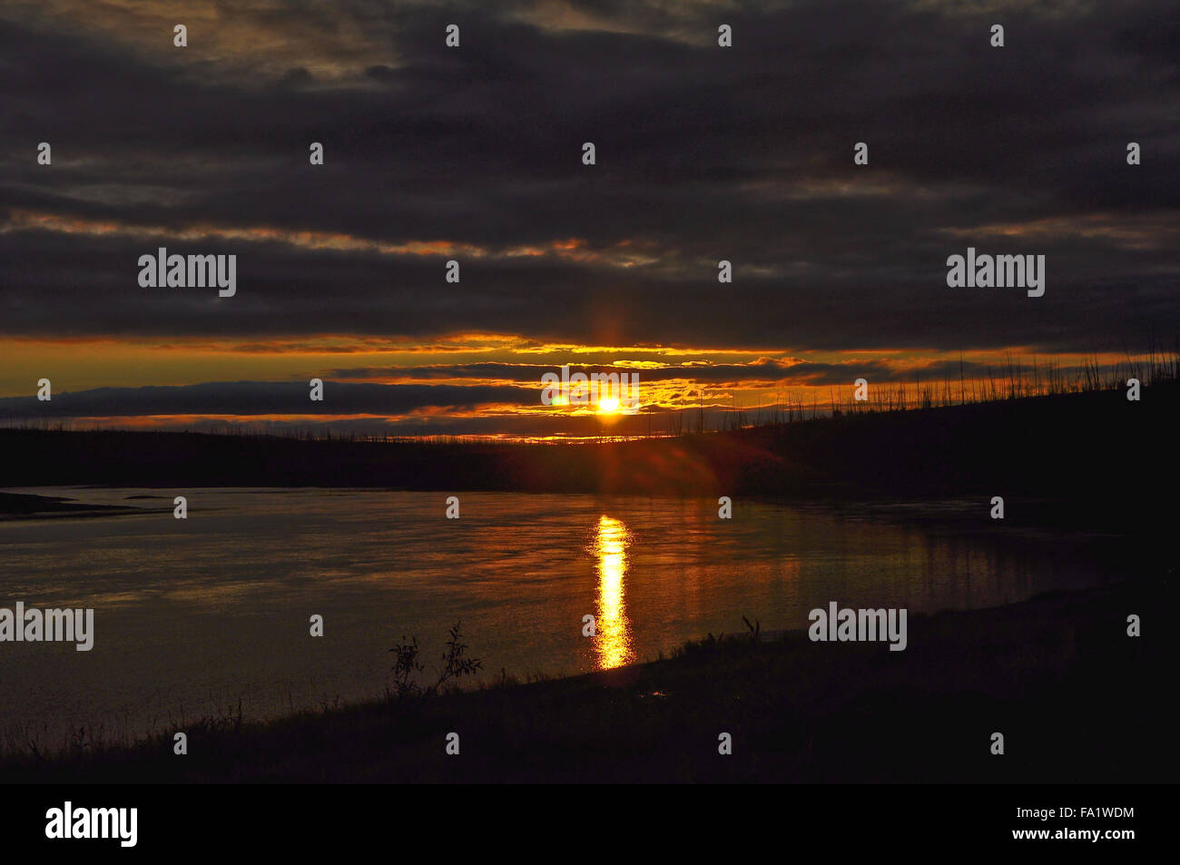 The river in the tundra the last rays of light settled behind the ...