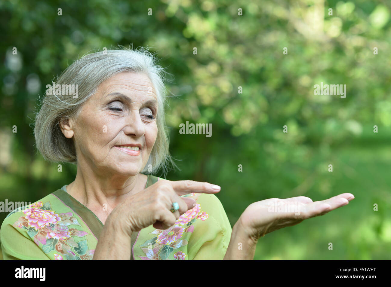 Older woman pointing Stock Photo - Alamy