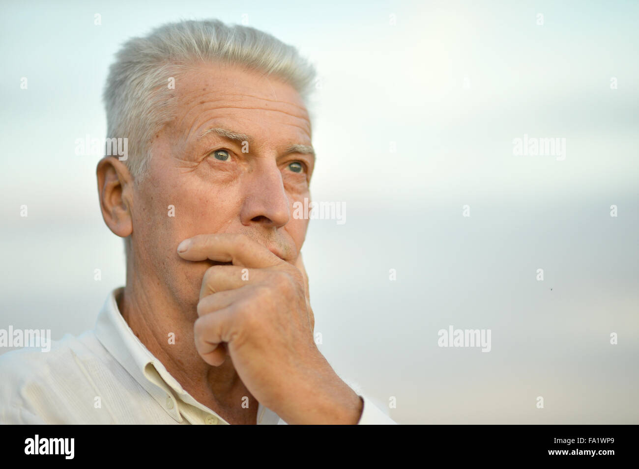 Senior man thinking Stock Photo - Alamy