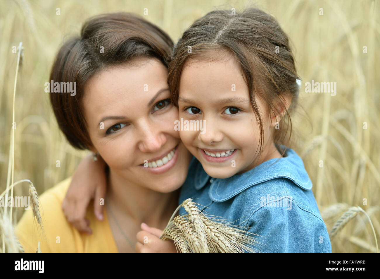 Mother and daughter at field Stock Photo - Alamy