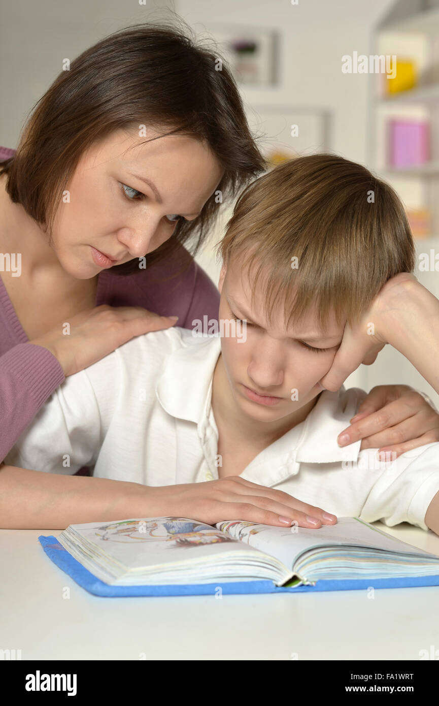 Mother and son doing homework Stock Photo - Alamy