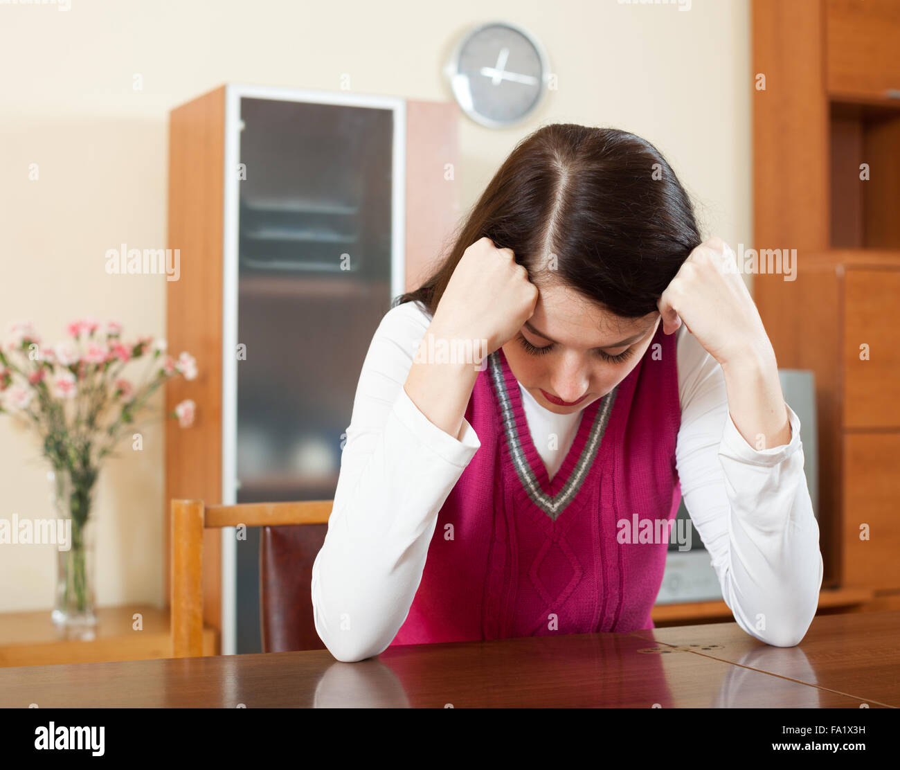 Crying lonely brunette woman at home Stock Photo - Alamy