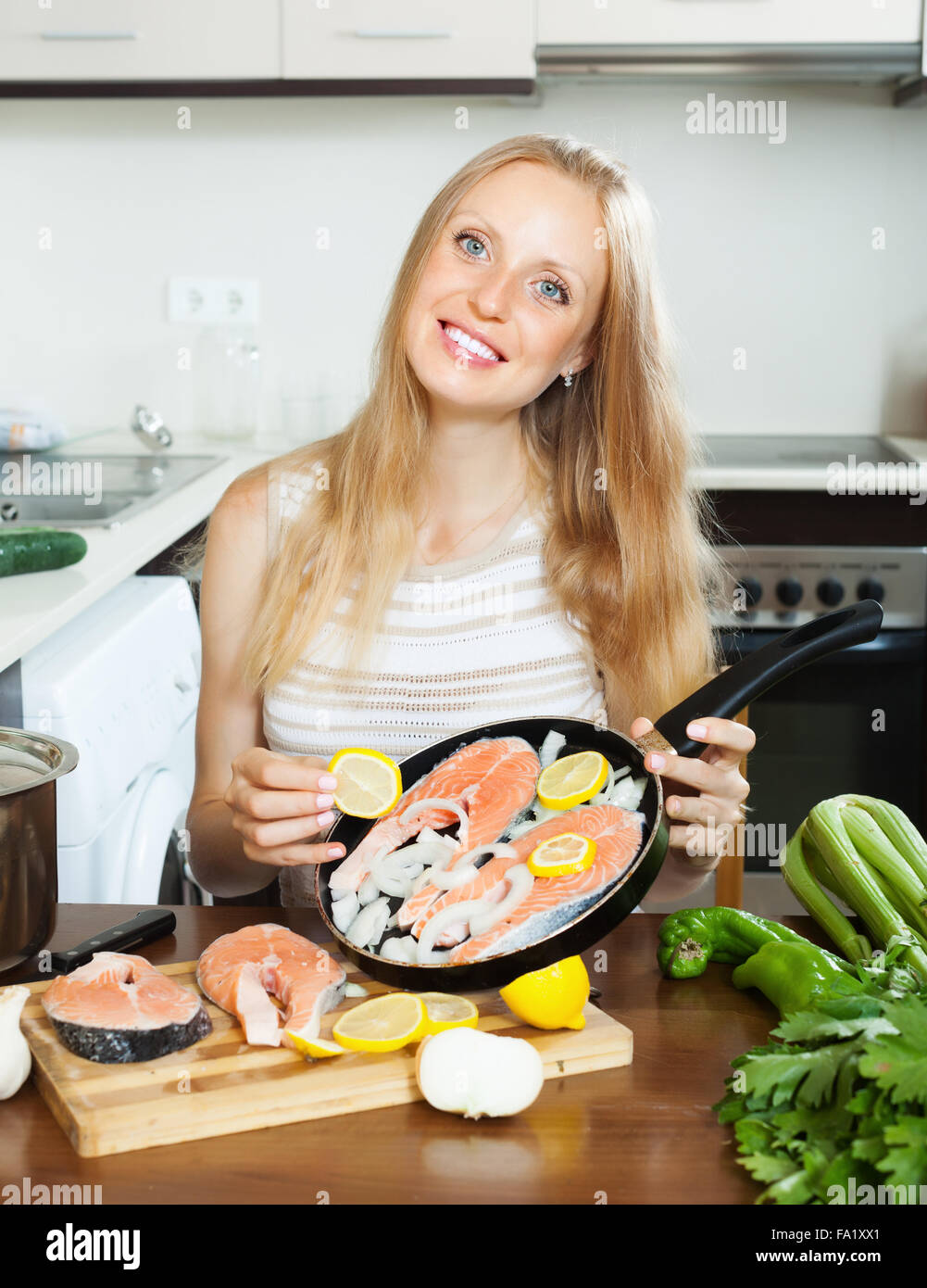 Smiling girl putting fish in hi-res stock photography and images - Alamy