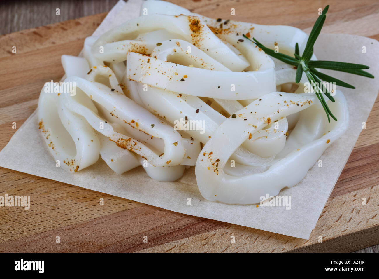 Raw squid rings herbs hi-res stock photography and images - Alamy