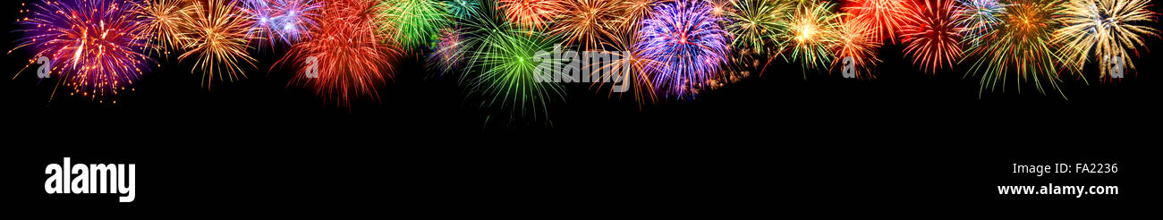 Gorgeous multi-colored fireworks as an extra wide panoramic border on ...