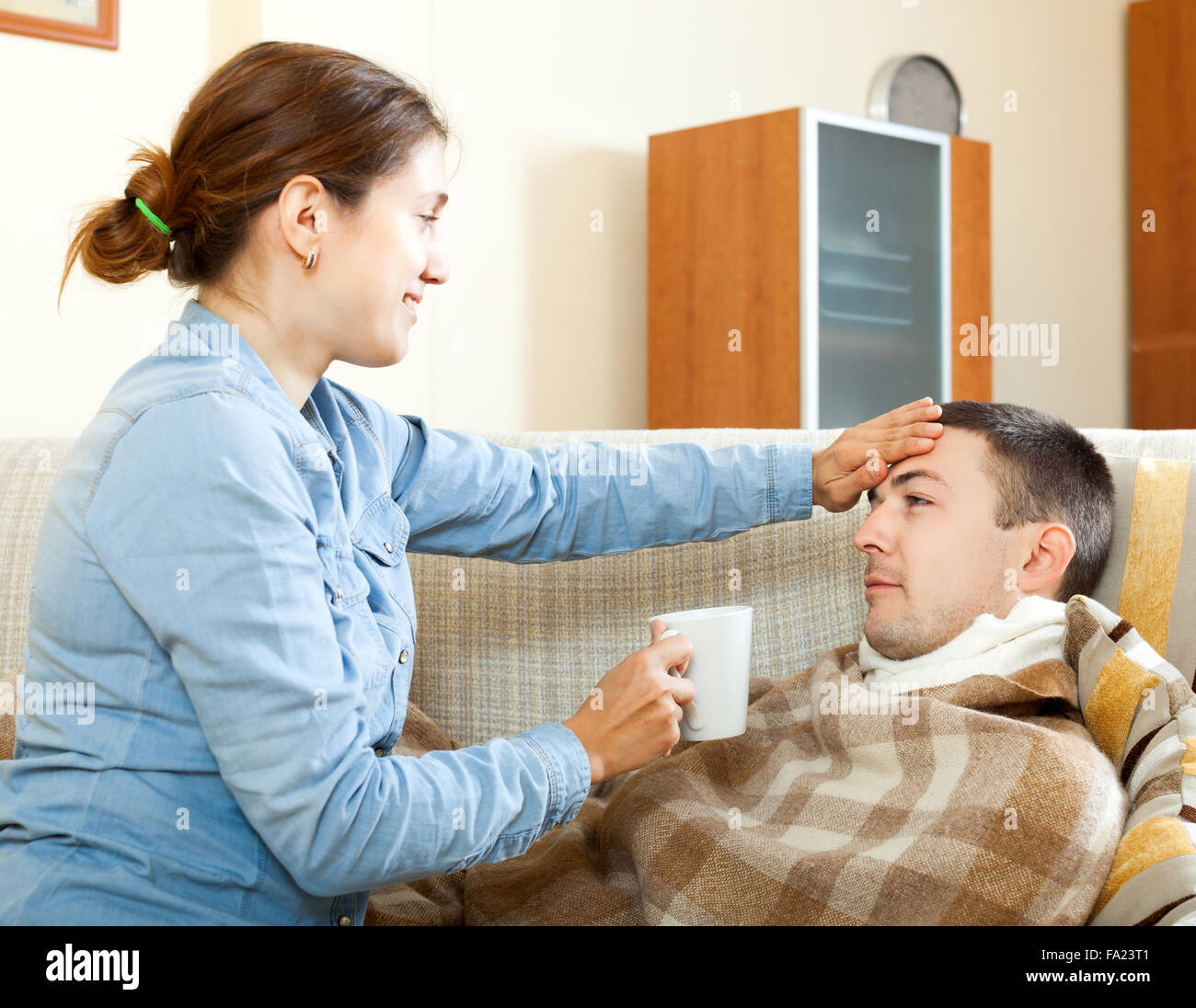 Wife nursing sick husband cold hi-res stock photography and images - Alamy