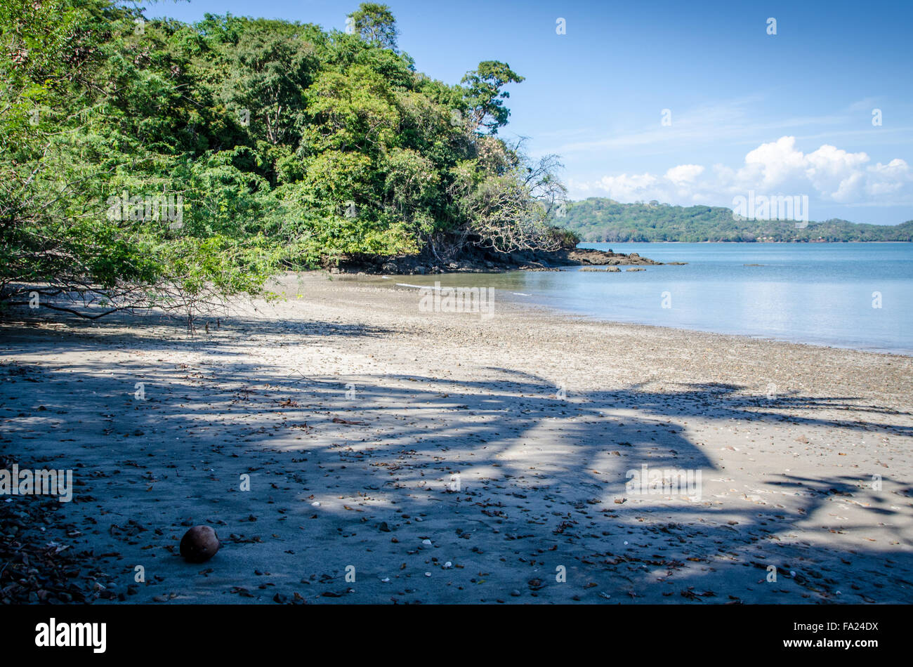 Deserted beach on a tropical island Stock Photo - Alamy
