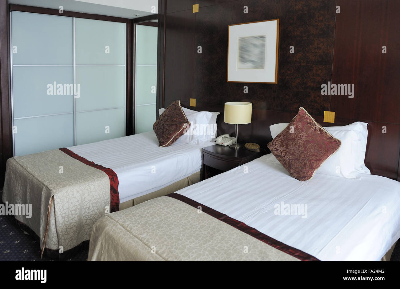 Hotel room with two clean single beds Stock Photo - Alamy