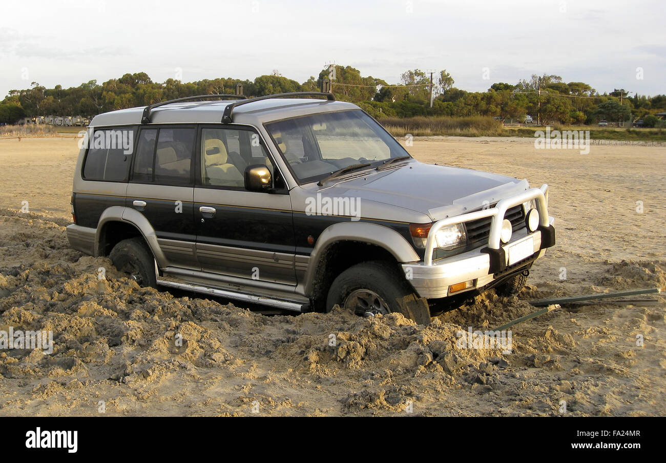 Four wheel drive broken down on the beach Stock Photo - Alamy