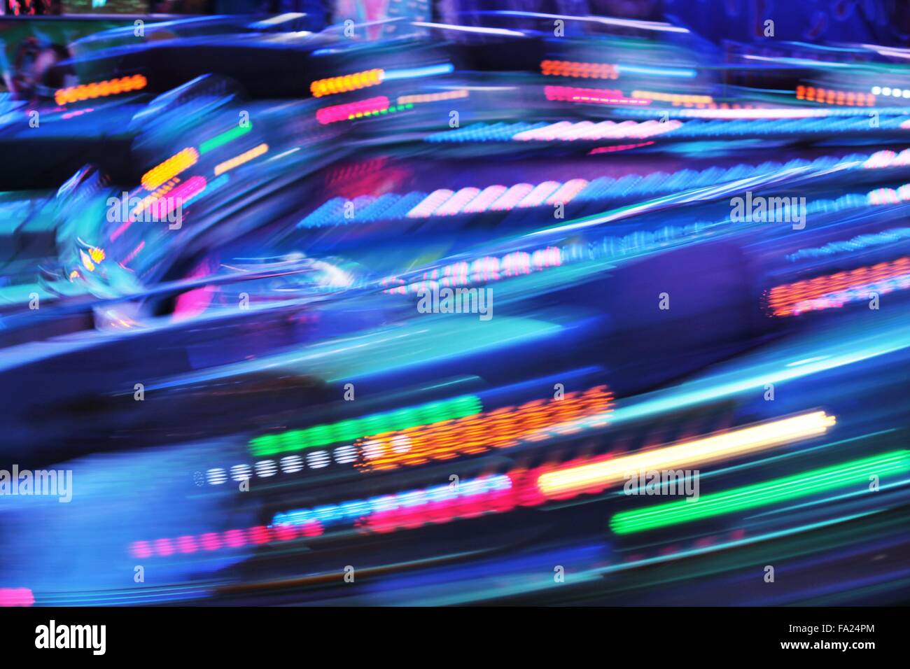 fairground funfair ride moving fast fair lights Night colours of the ...