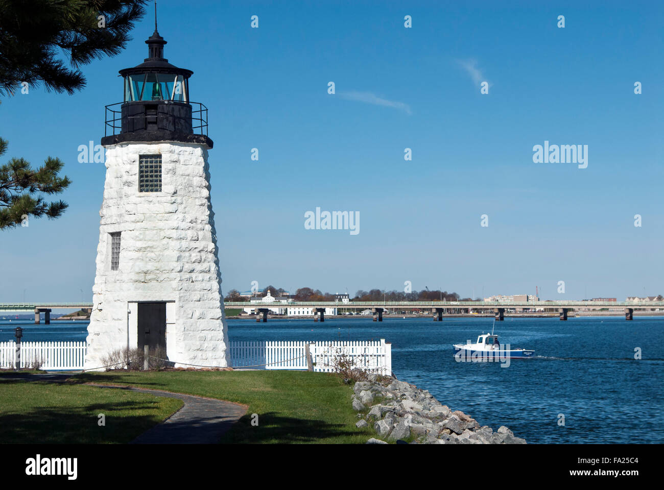 Lobster boat passes by Newport Harbor Lighthouse in Rhode Island ...