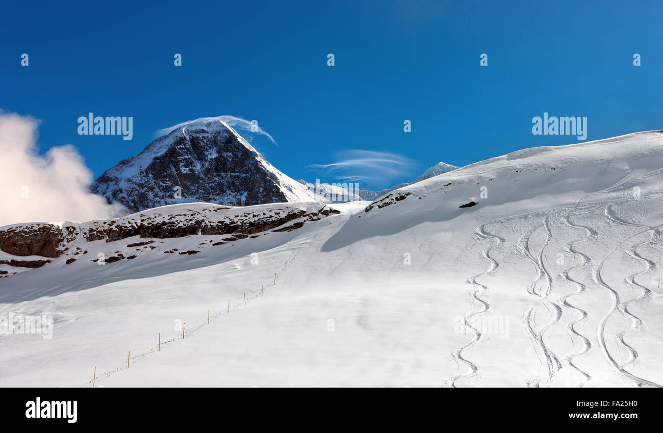 Ski slope in the background of Mount Eiger. The Eiger is a mountain in ...