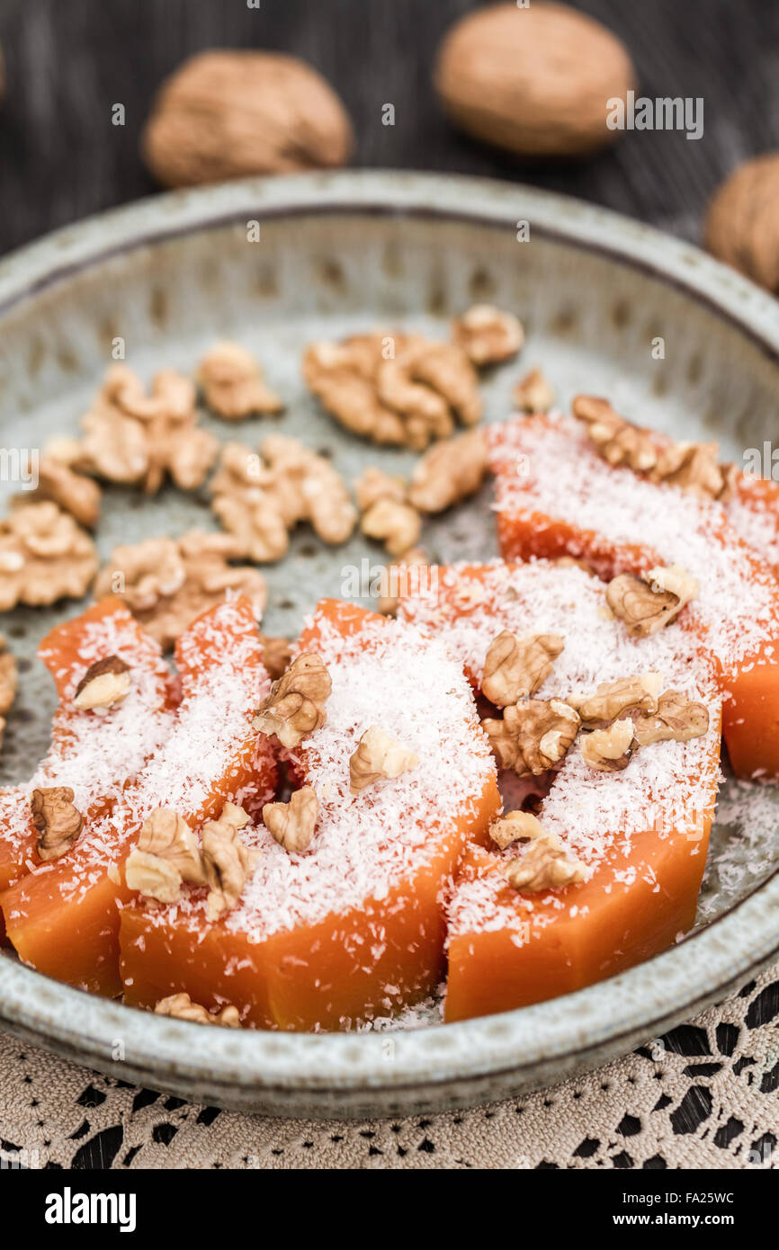 Delicious traditional Turkish pumpkin dessert in a tinned copper plate ...