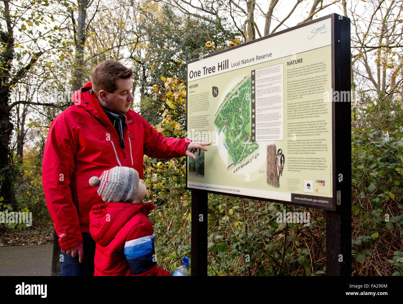 Father and son looking at a map Stock Photo - Alamy