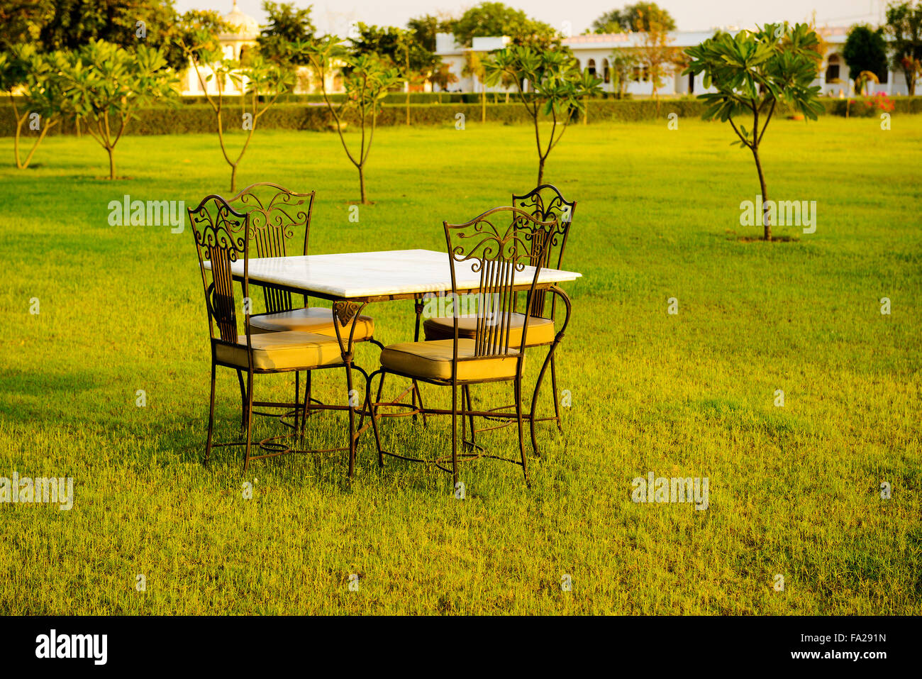 Table with chairs ready for breakfast outdoors in the morning ...