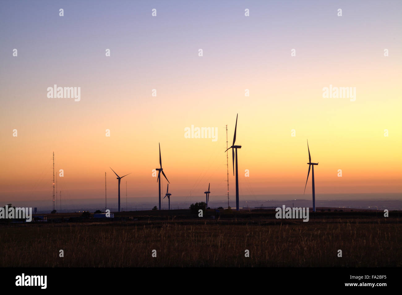 Windmills at sunrise Stock Photo - Alamy