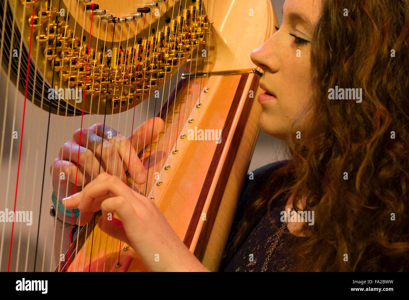 Girl playing harp hi-res stock photography and images - Alamy