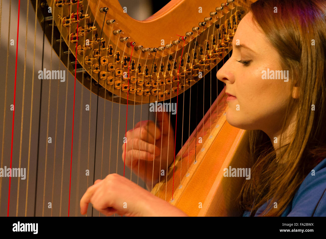 Girl playing harp hi-res stock photography and images - Alamy