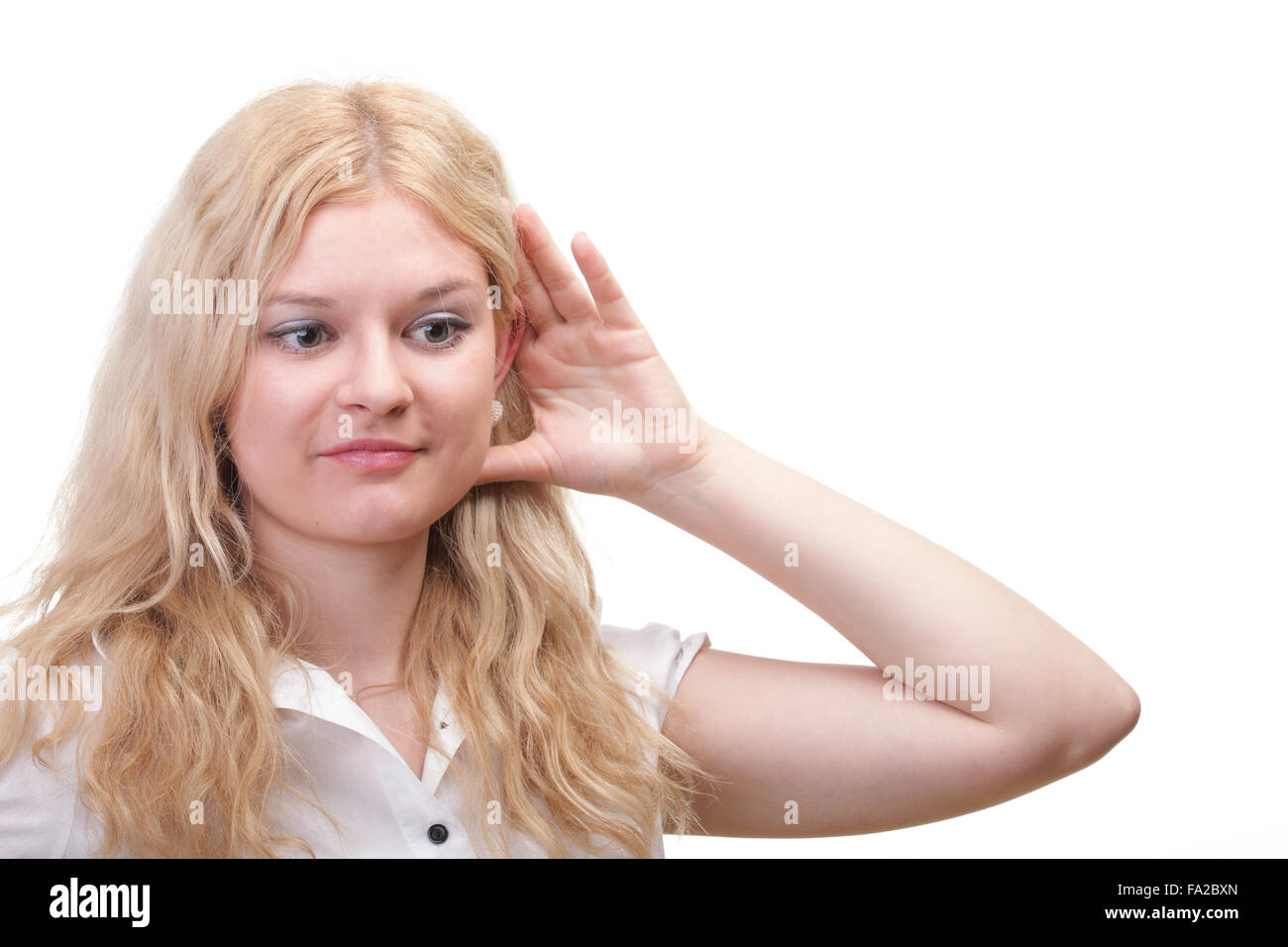 Business woman eavesdropping with hand behind her ear Stock Photo - Alamy