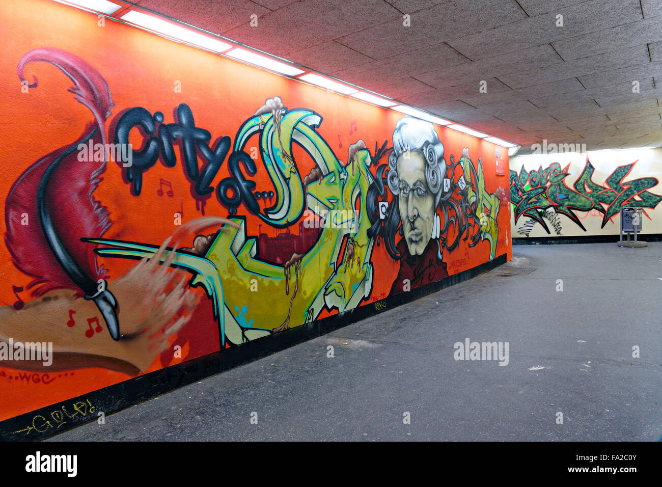Graffiti with portrait of composer Mozart in underground passageway ...