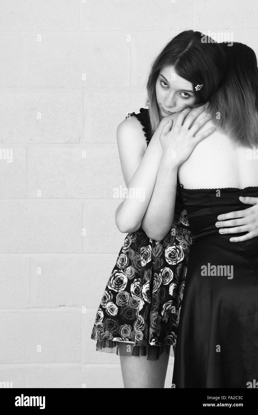 Two friends hugging each other Stock Photo - Alamy