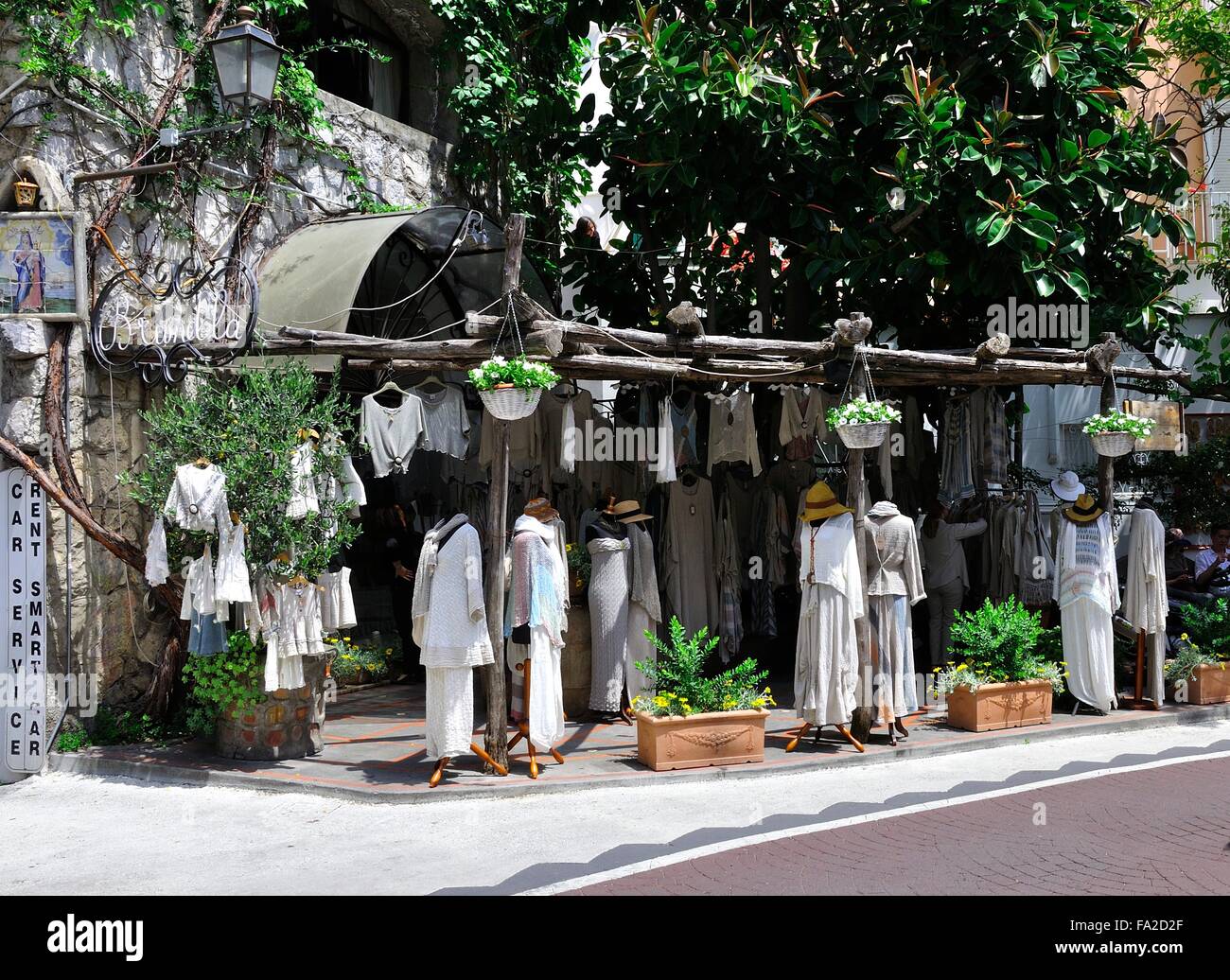 Shop selling fashionable clothing in Positano, Italy Stock Photo - Alamy