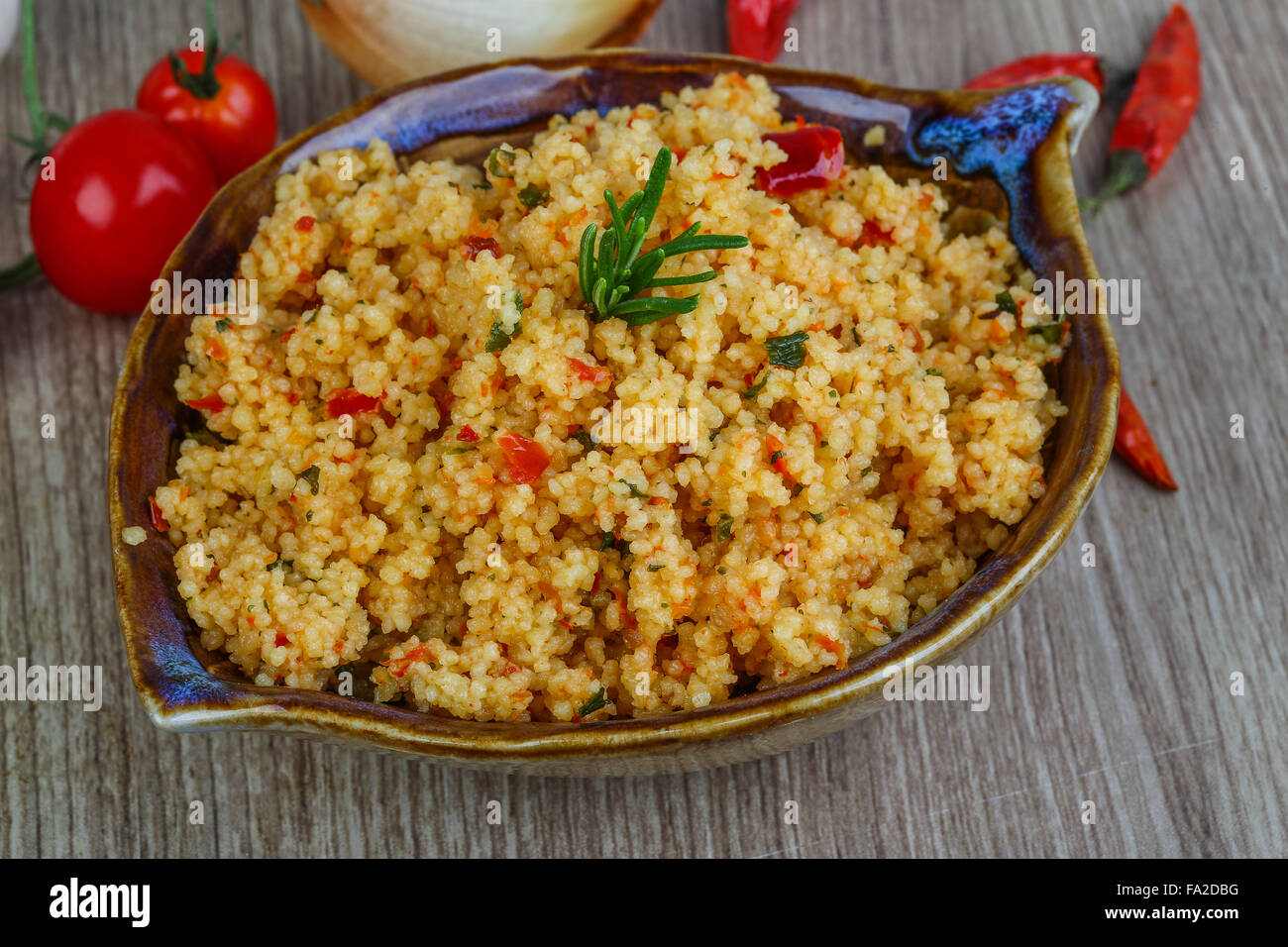 Arabic traditional cuisine - Couscous with tomato and green onion Stock ...