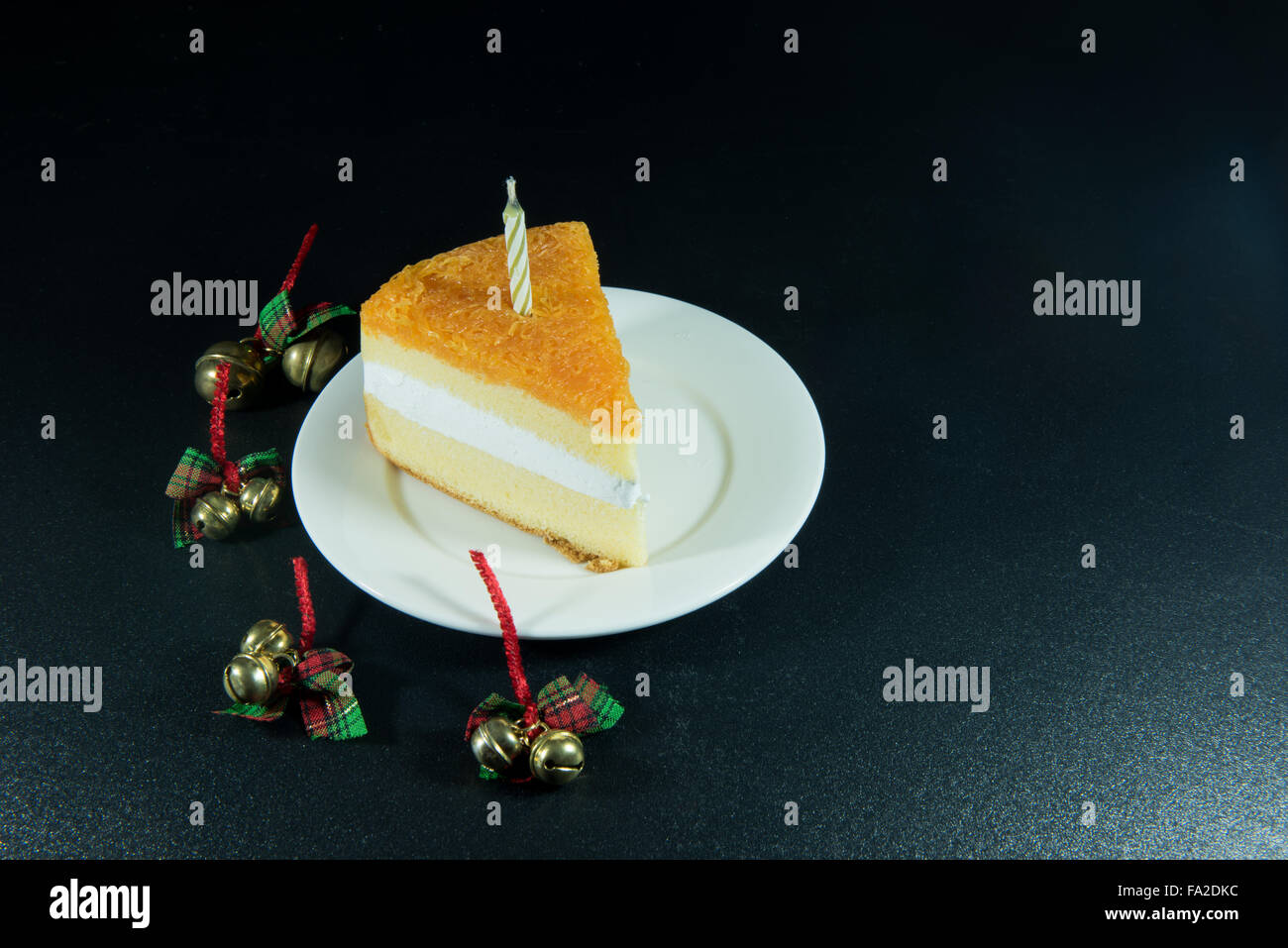 Gold threads cake isolated on background black Stock Photo - Alamy