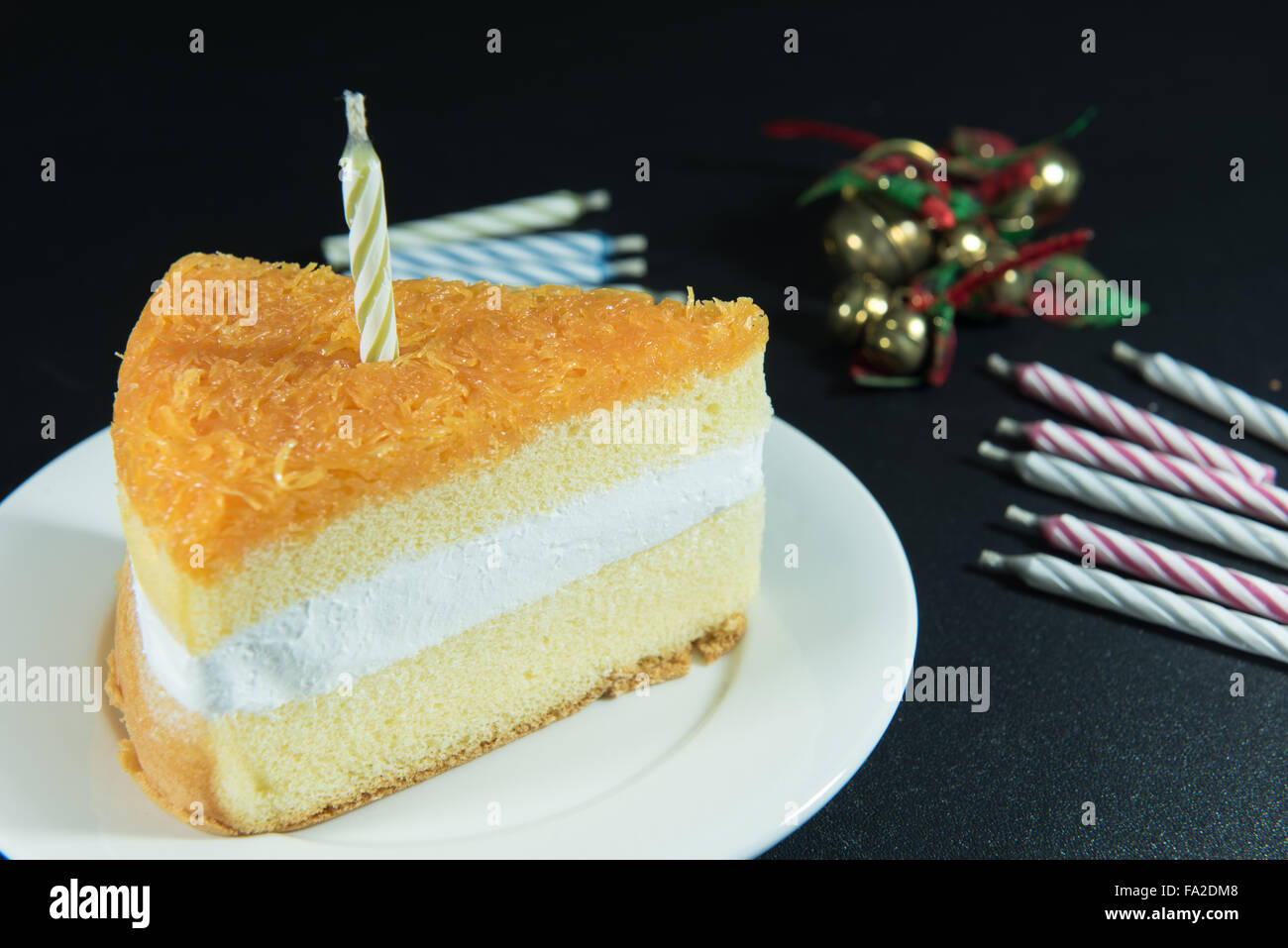 Gold threads cake isolated on background black Stock Photo - Alamy