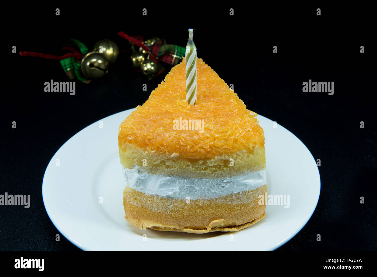 Gold threads cake isolated on background black Stock Photo - Alamy