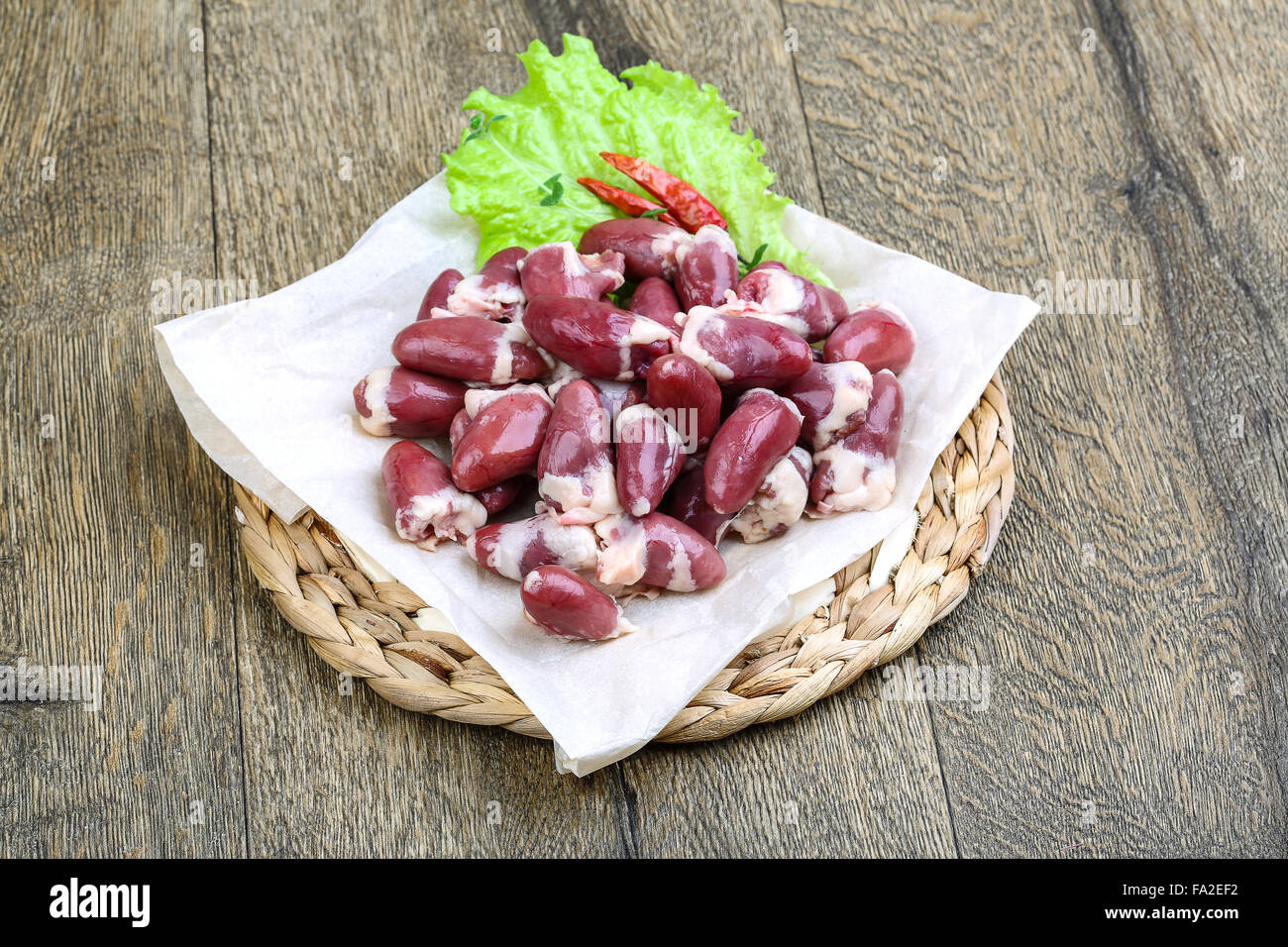 Raw chicken hearts ready for cooking on the wood background Stock Photo ...