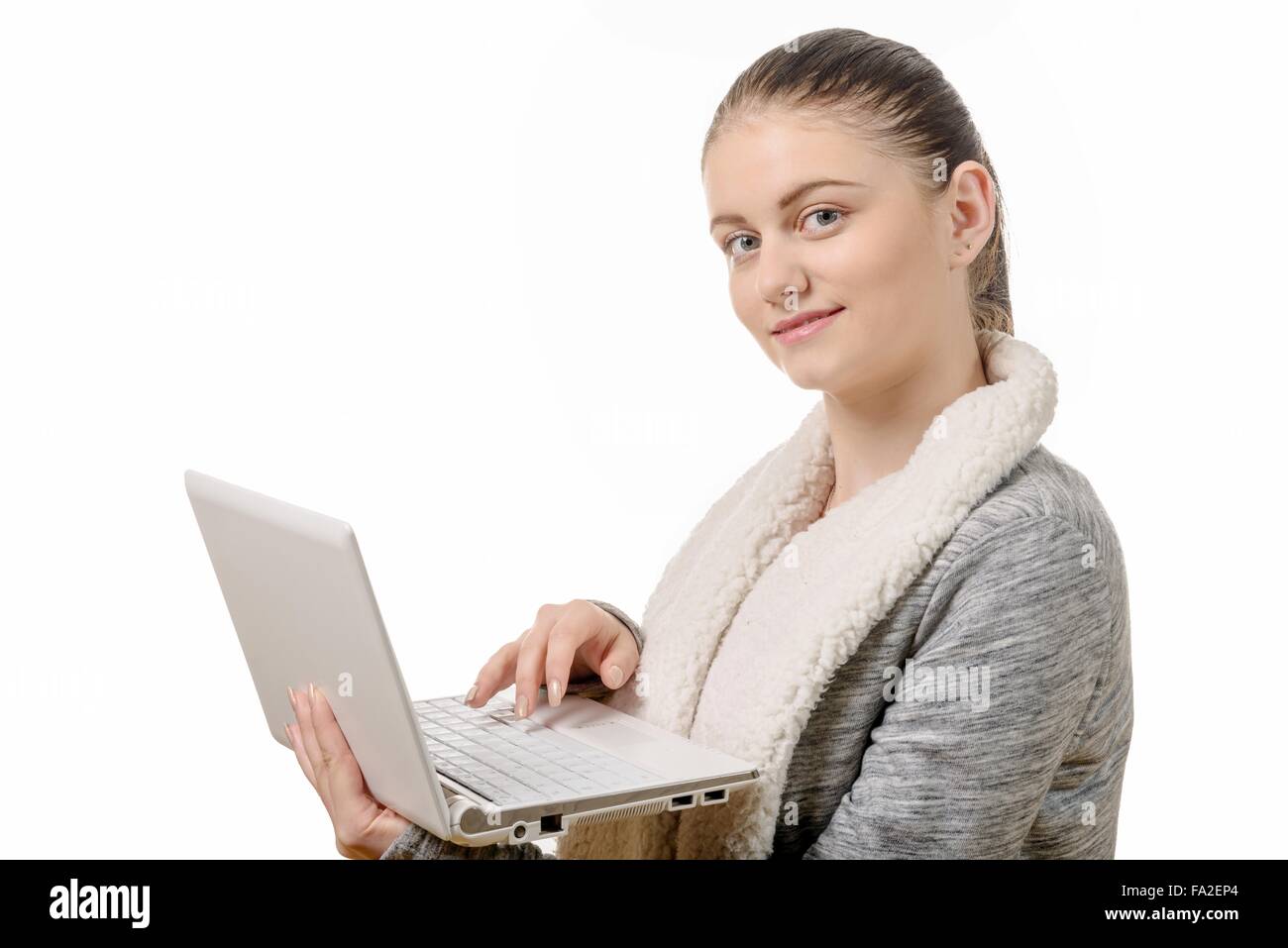 a portrait of beautiful girl using laptop on white background Stock ...