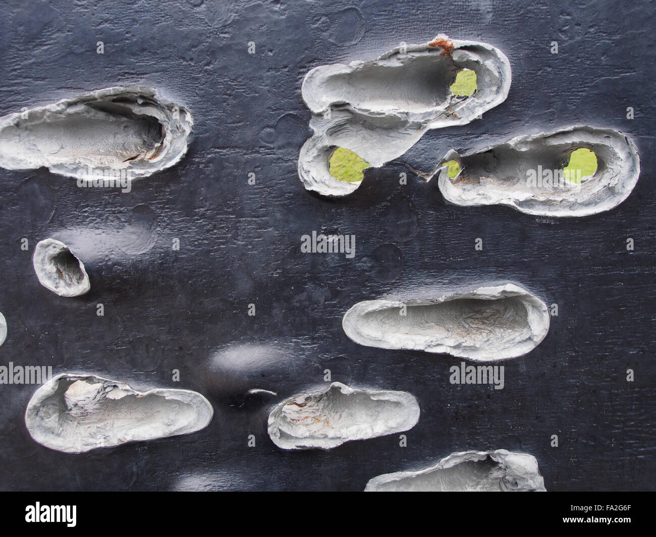 The effect of Armour piercing ammunition on steel plating Stock Photo ...