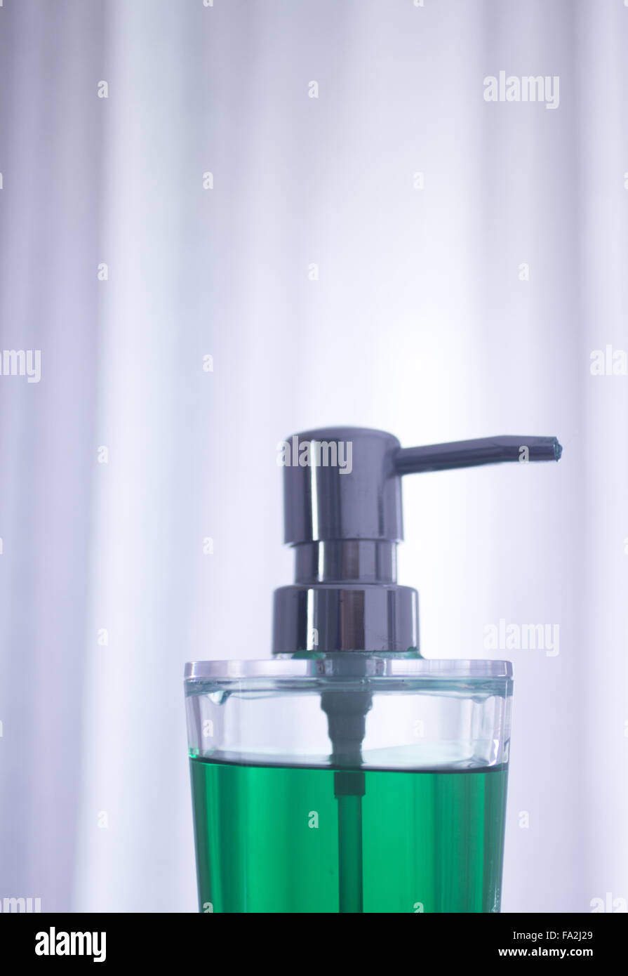 Hand soap hygiene liquid dispenser for washing hands Stock Photo - Alamy