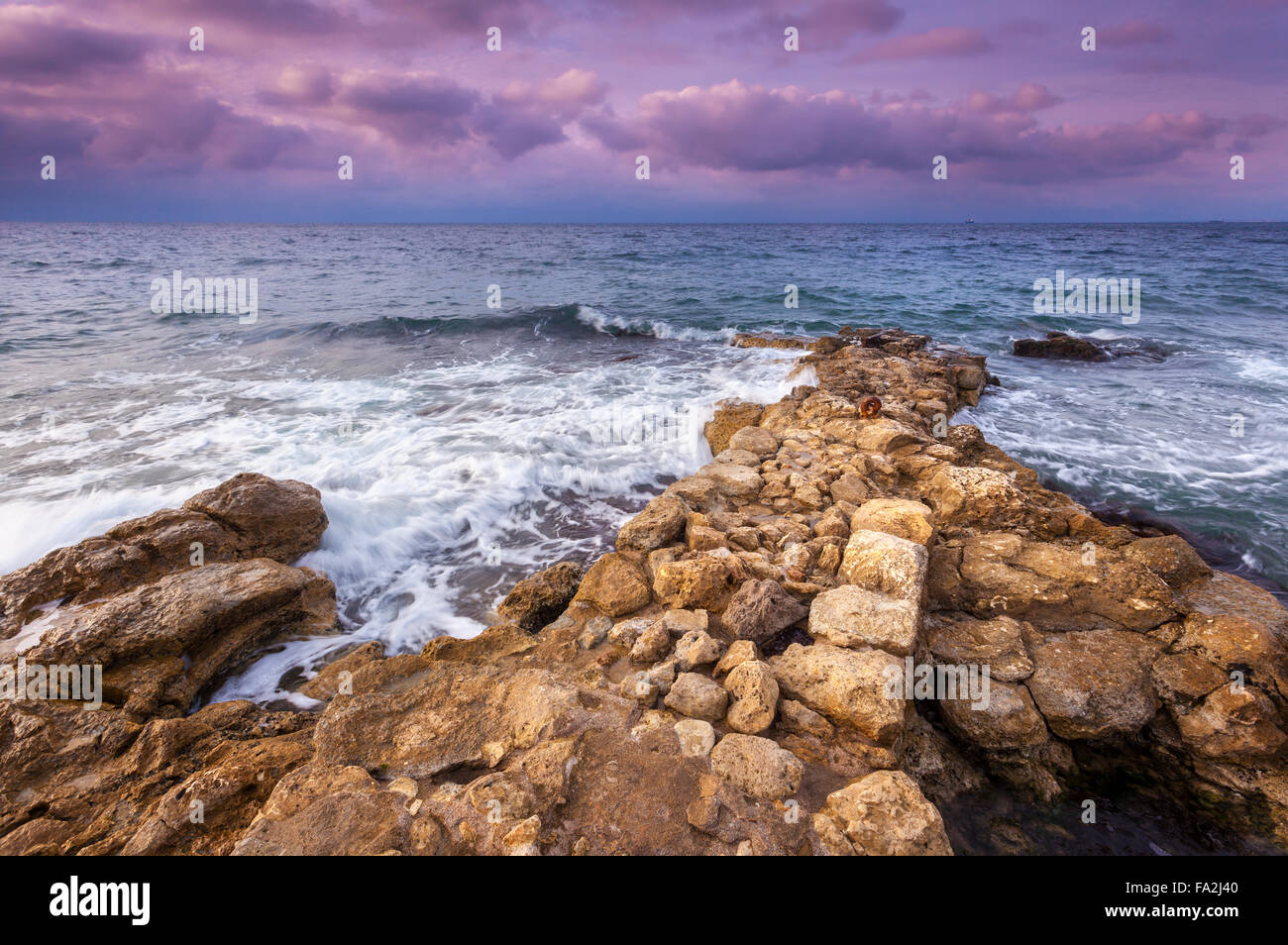 Sea waves with rocks on the beach at sunset. Beatuful landscape Stock ...