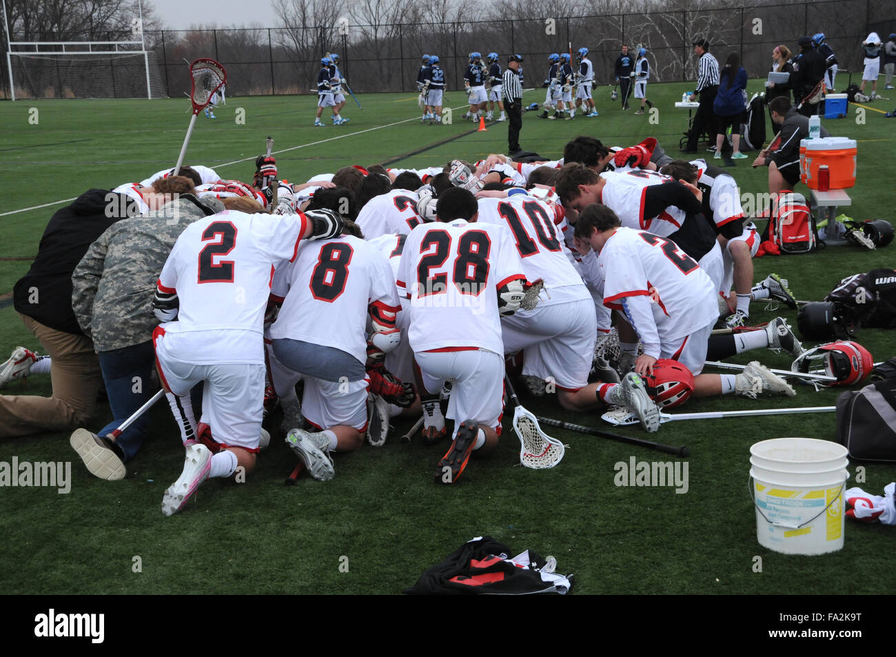 High school lacrosse team says a prayer before game Stock Photo - Alamy