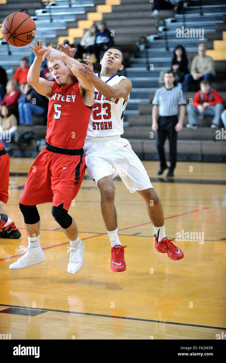 While driving on the hoop, a forward is fouled by an opponent sending ...