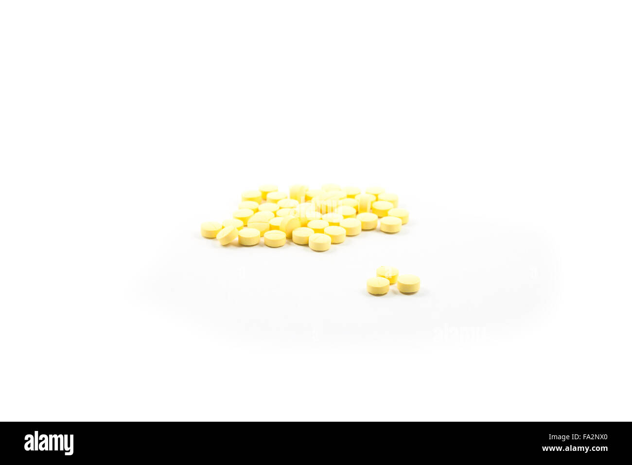 Yellow pills isolated on white background, stock photo Stock Photo - Alamy