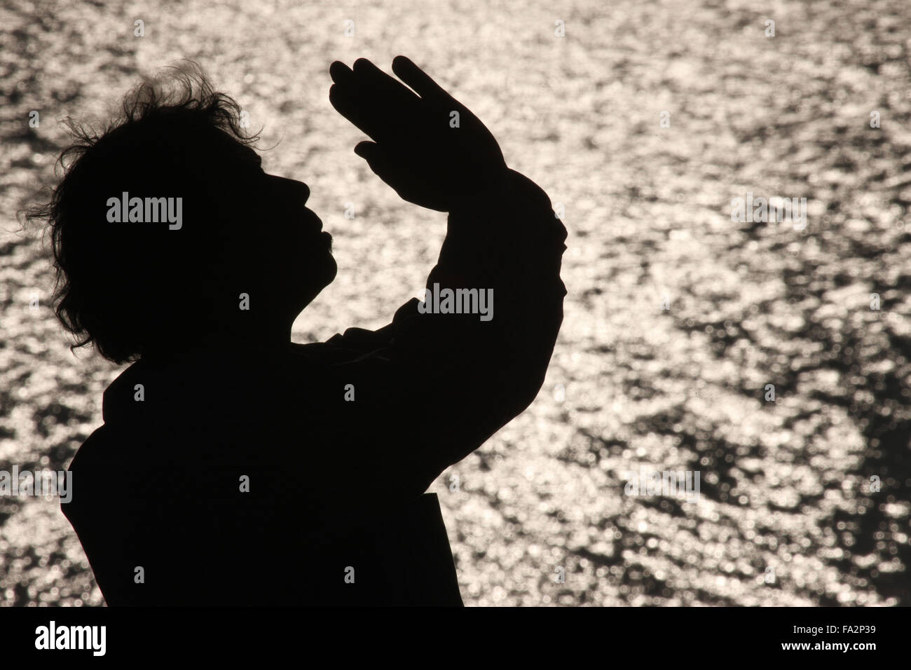 Praying at the seaside Stock Photo - Alamy