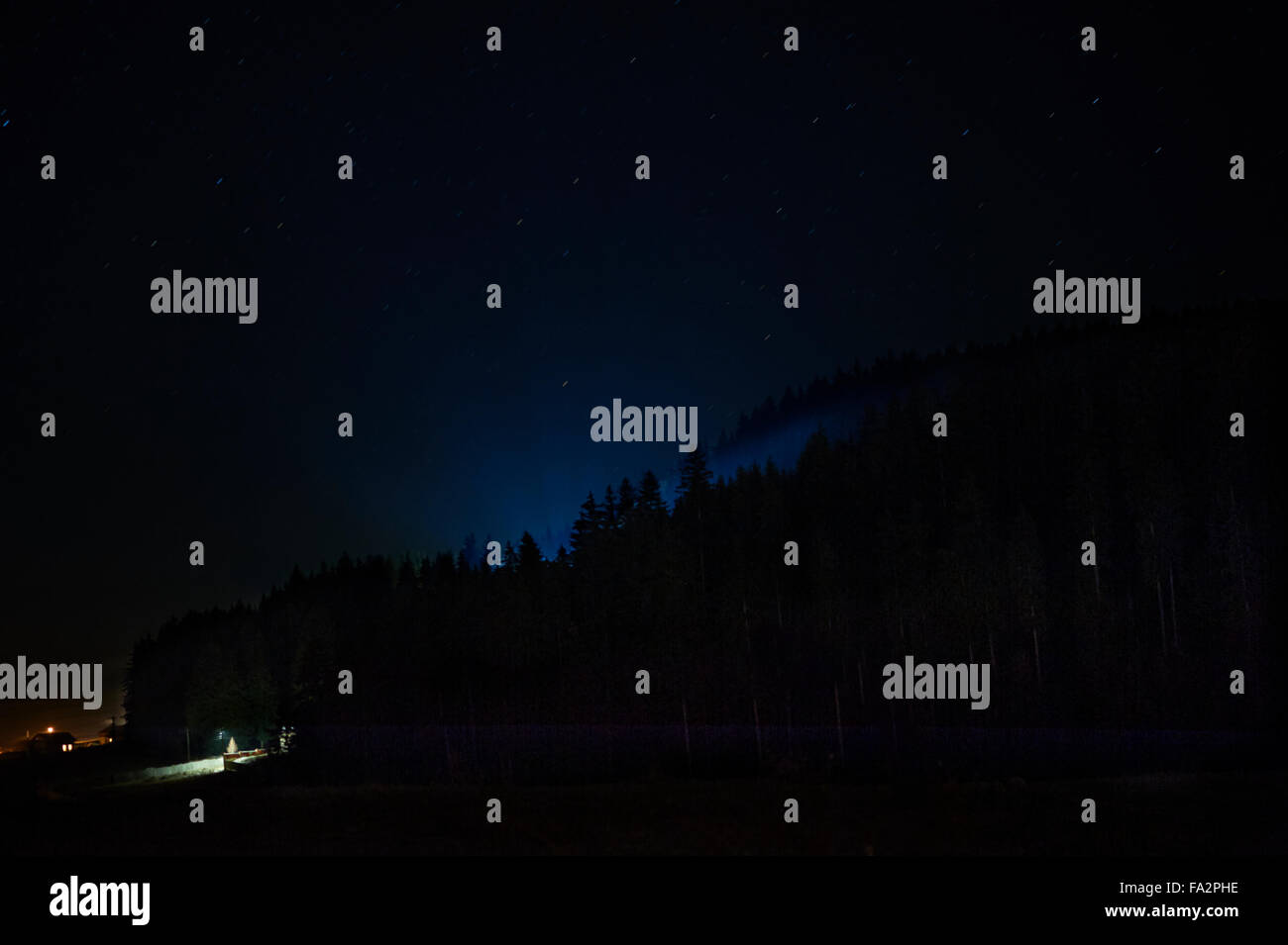 Night sky blue trees mountains hi-res stock photography and images - Alamy