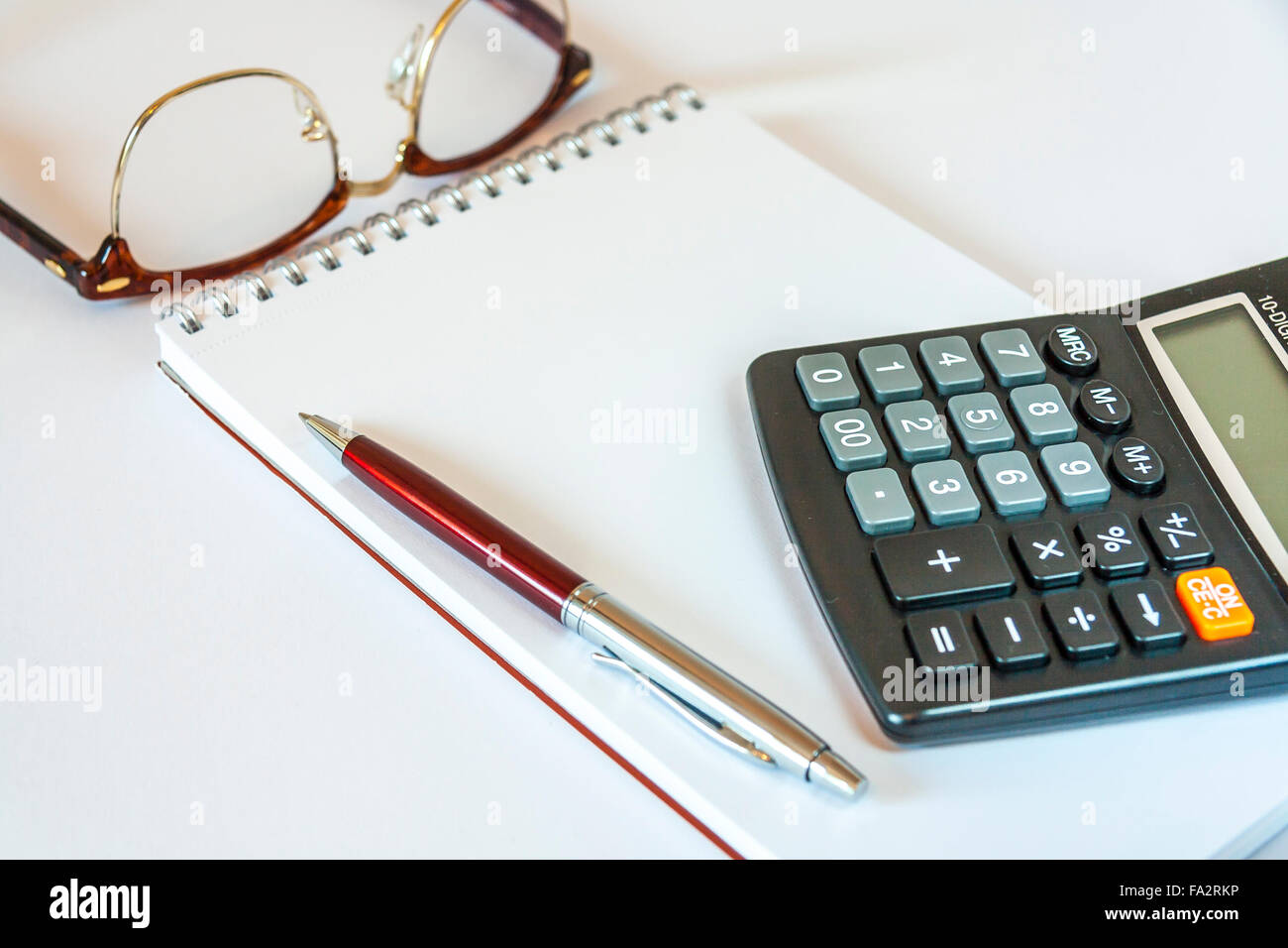 Calculator notepad pen eyeglasses hi-res stock photography and images ...