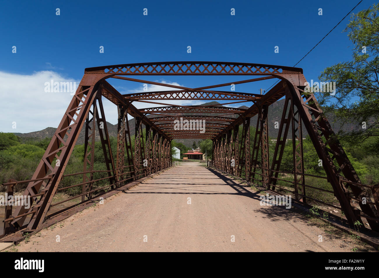 Photograph of a steel bridge construction over a river in the small ...
