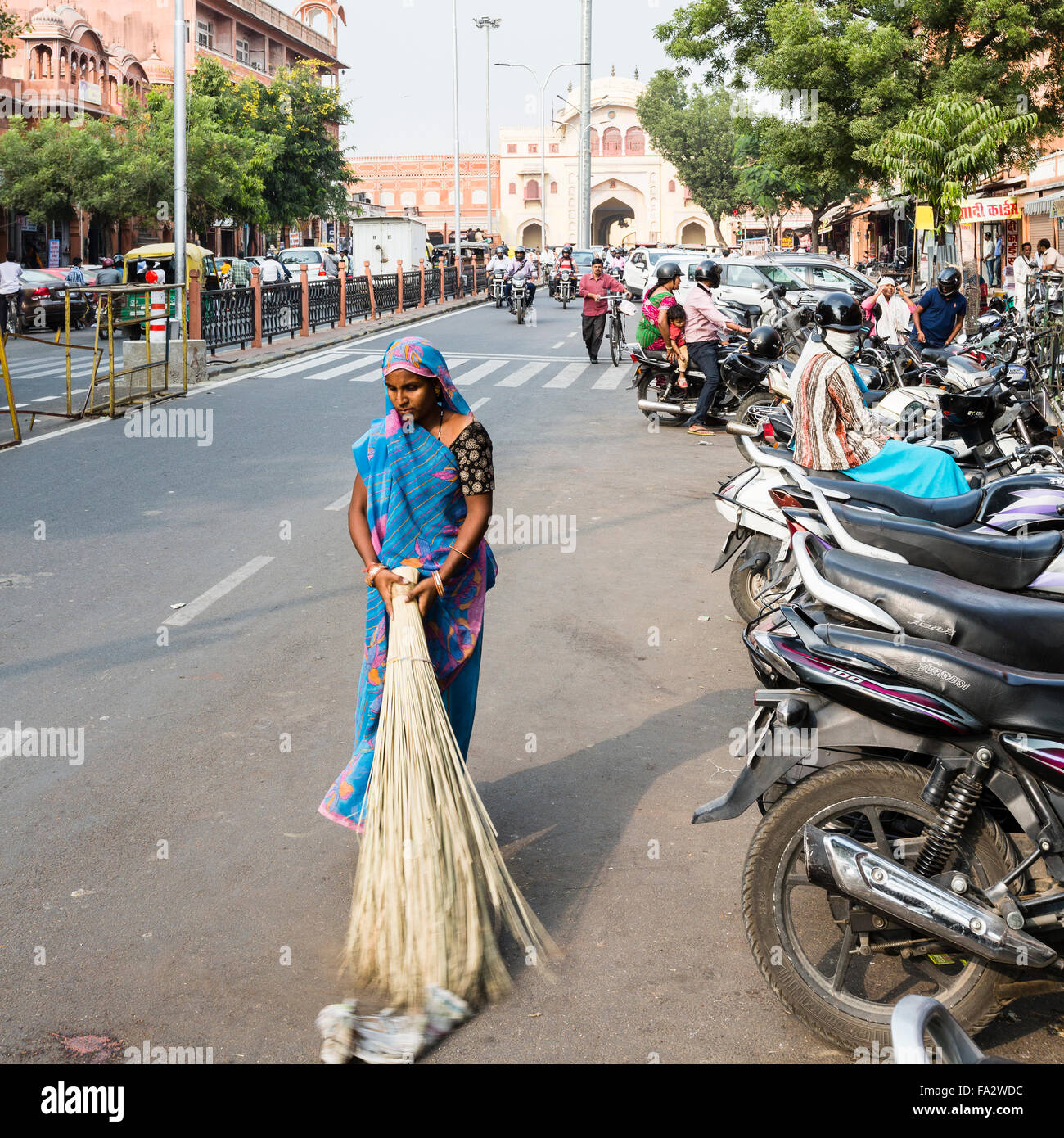Lady in street with broom hi-res stock photography and images - Alamy
